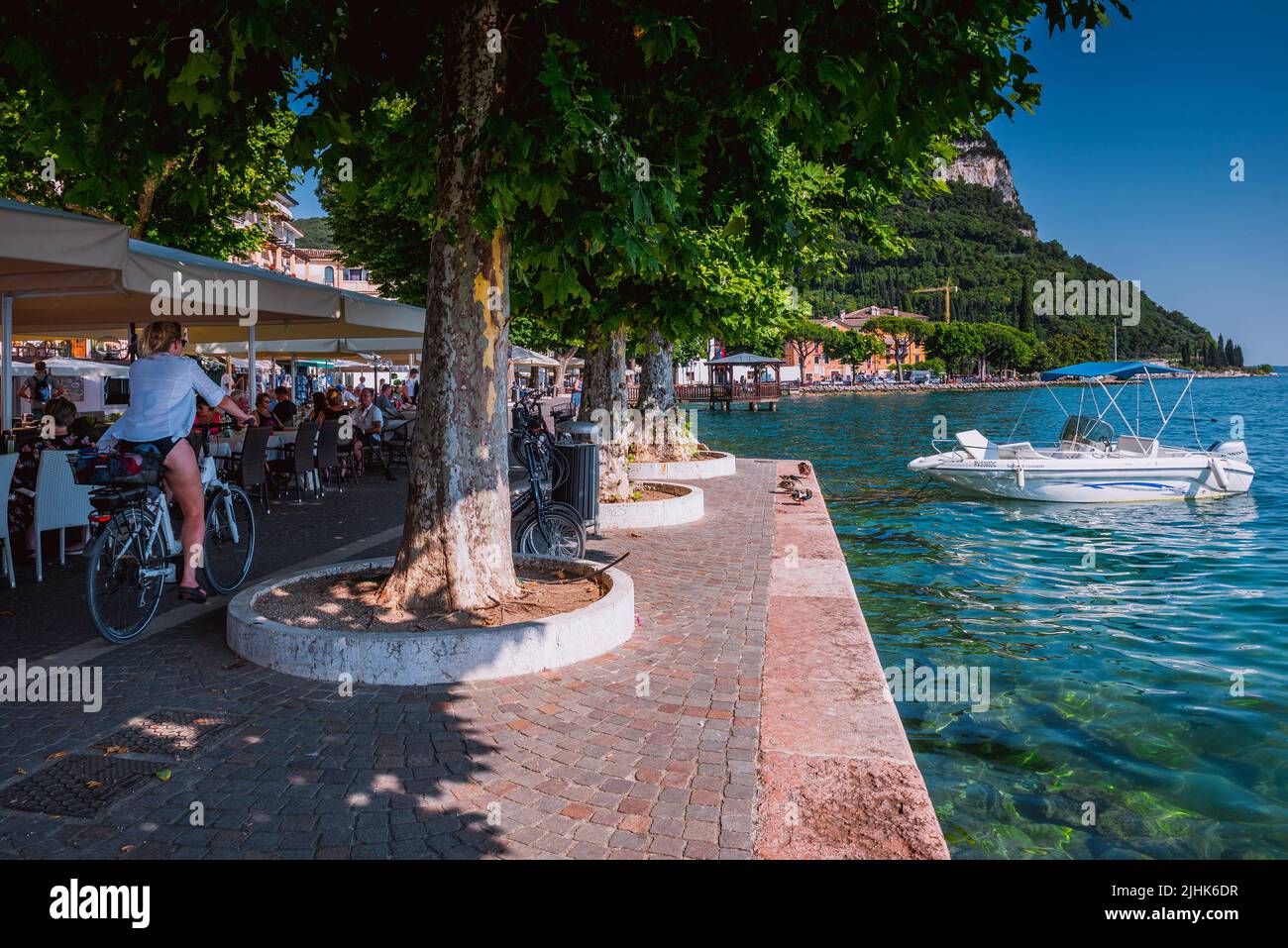 Garda promenade. Garda is a town and comune on the shore of Lake Garda ...