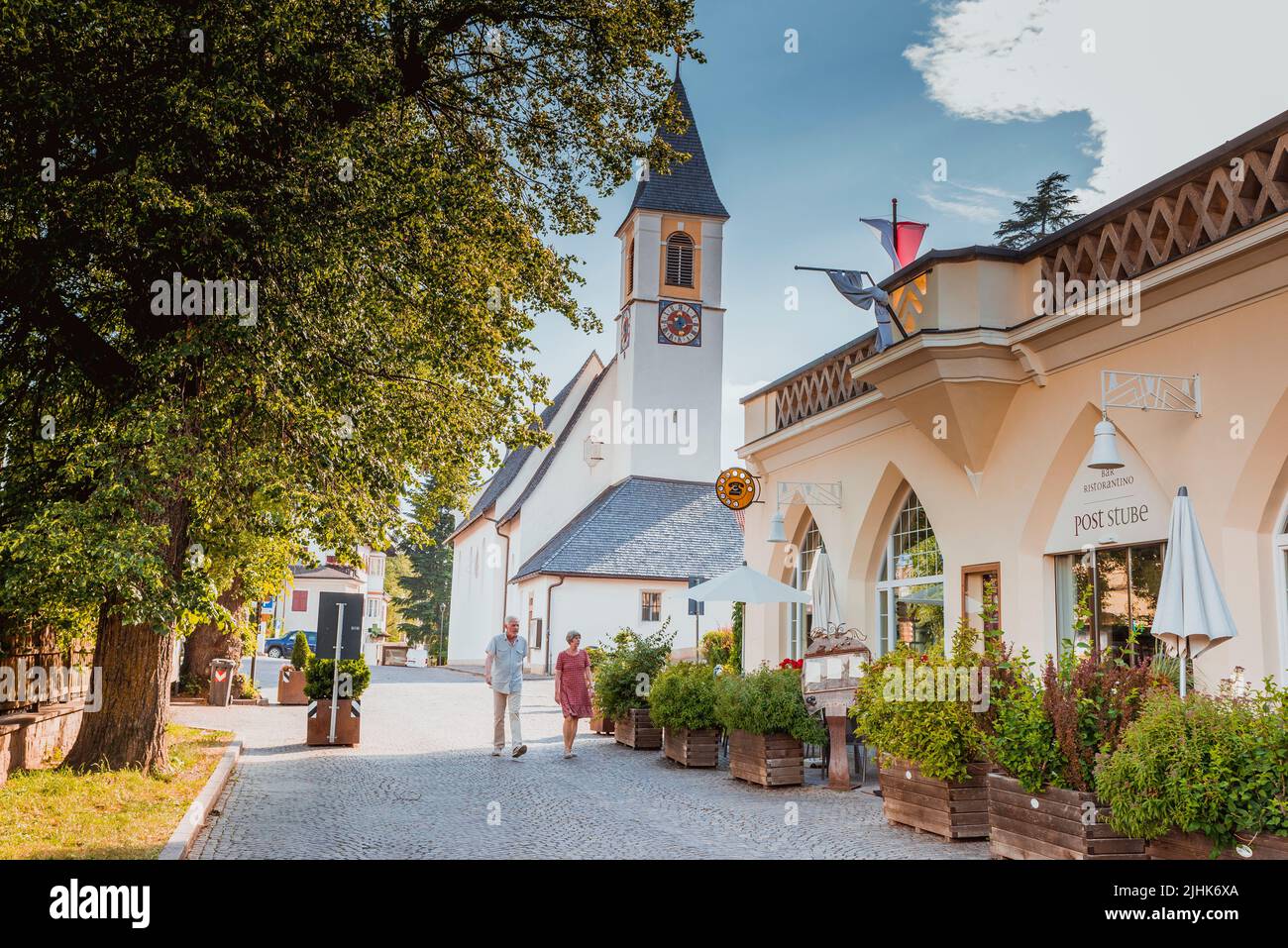 View of a street in Collalbo, in the background the church of St ...
