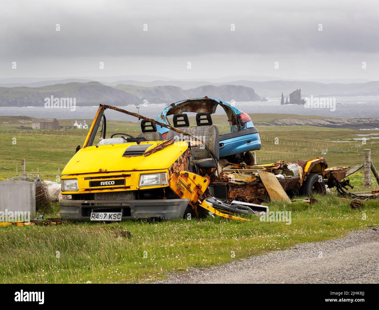 Abandoned vehicles rusting on a croft at Esha Ness, Shetland, Scotland ...