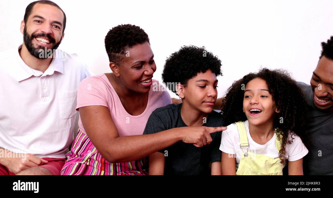 Family waving hello to camera speaking video conference POV Stock Photo ...