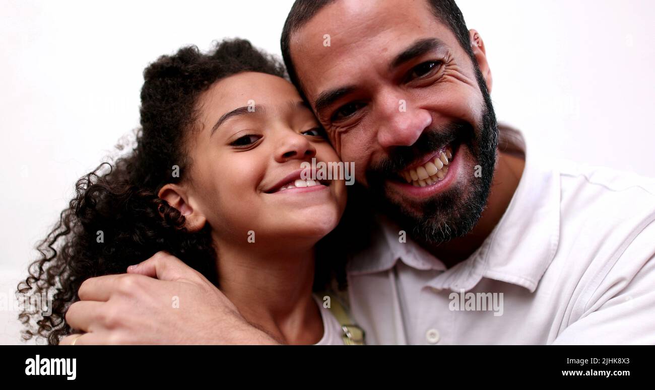 Father and daughter smiling at camera. real casual people. Child and ...
