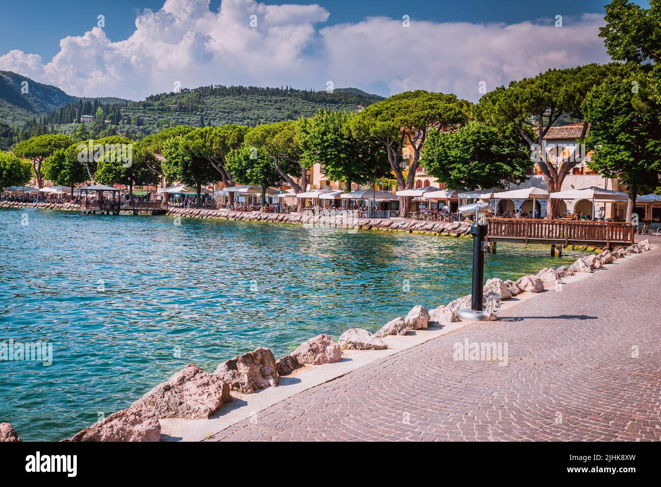Garda promenade. Garda is a town and comune on the shore of Lake Garda ...