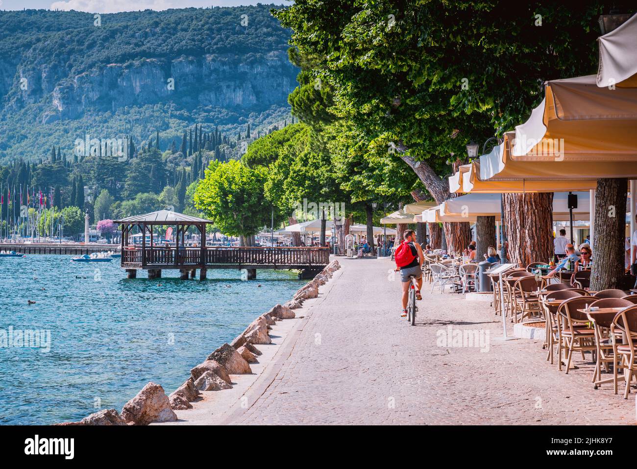 Garda promenade. Garda is a town and comune on the shore of Lake Garda ...