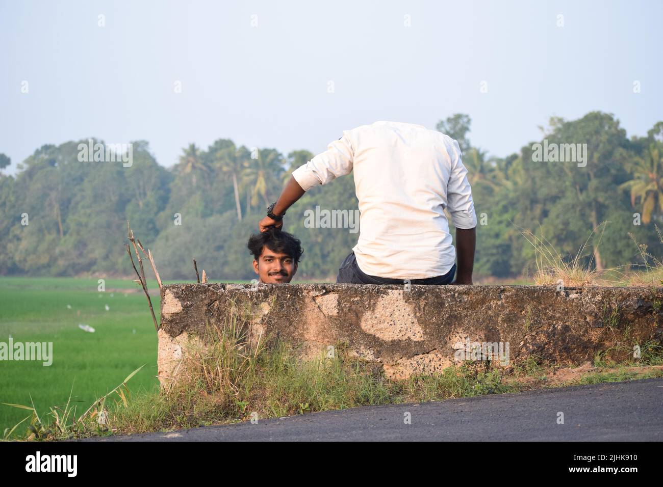 Two young men posing for photo in a creative way. Concept- creative ...