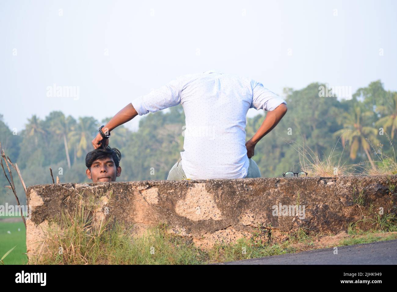 Two young men posing for photo in a creative way. Concept- creative ...