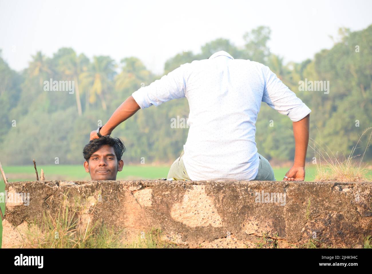 Two young men posing for photo in a creative way. Concept- creative ...