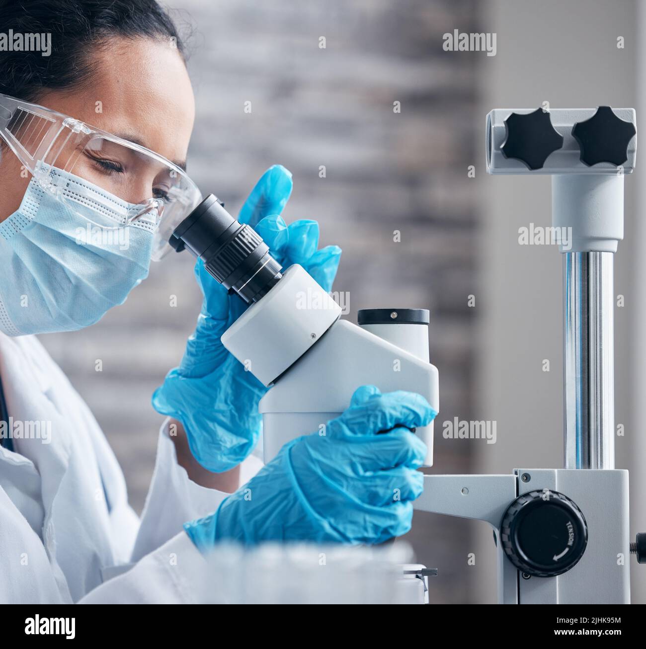 Notices the changes as they appear. a young scientist using a ...