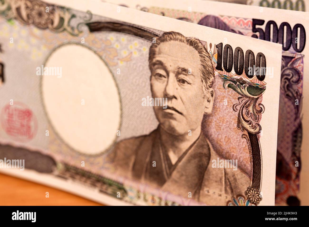 Japanese money - yen a business background Stock Photo - Alamy
