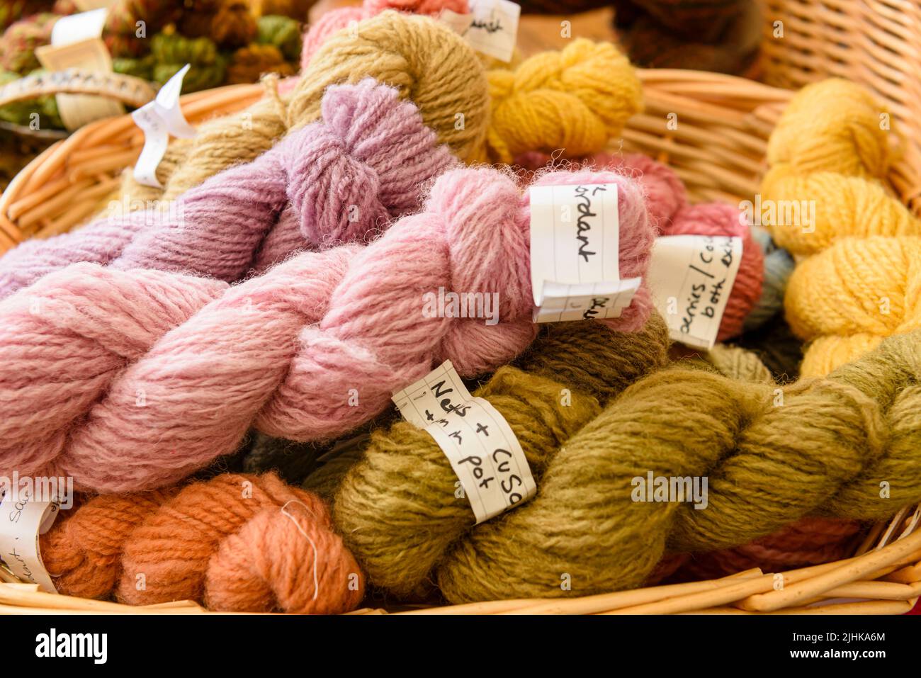 Sheep wool dyed using natural dyes in a basket Stock Photo - Alamy