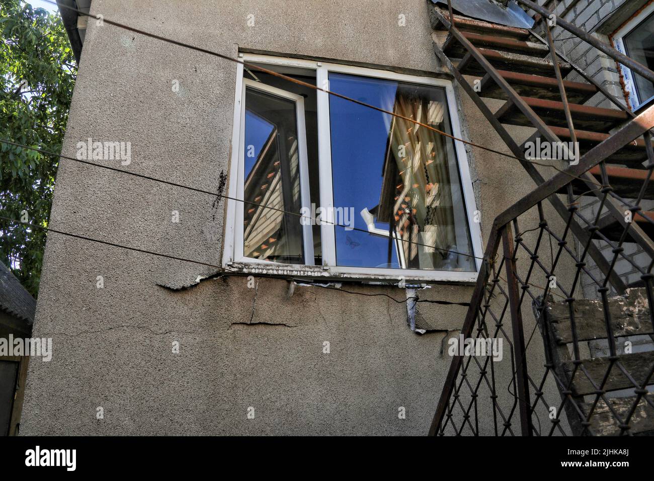DACHNE, UKRAINE - JULY 19, 2022 - A building shows damage caused by a ...
