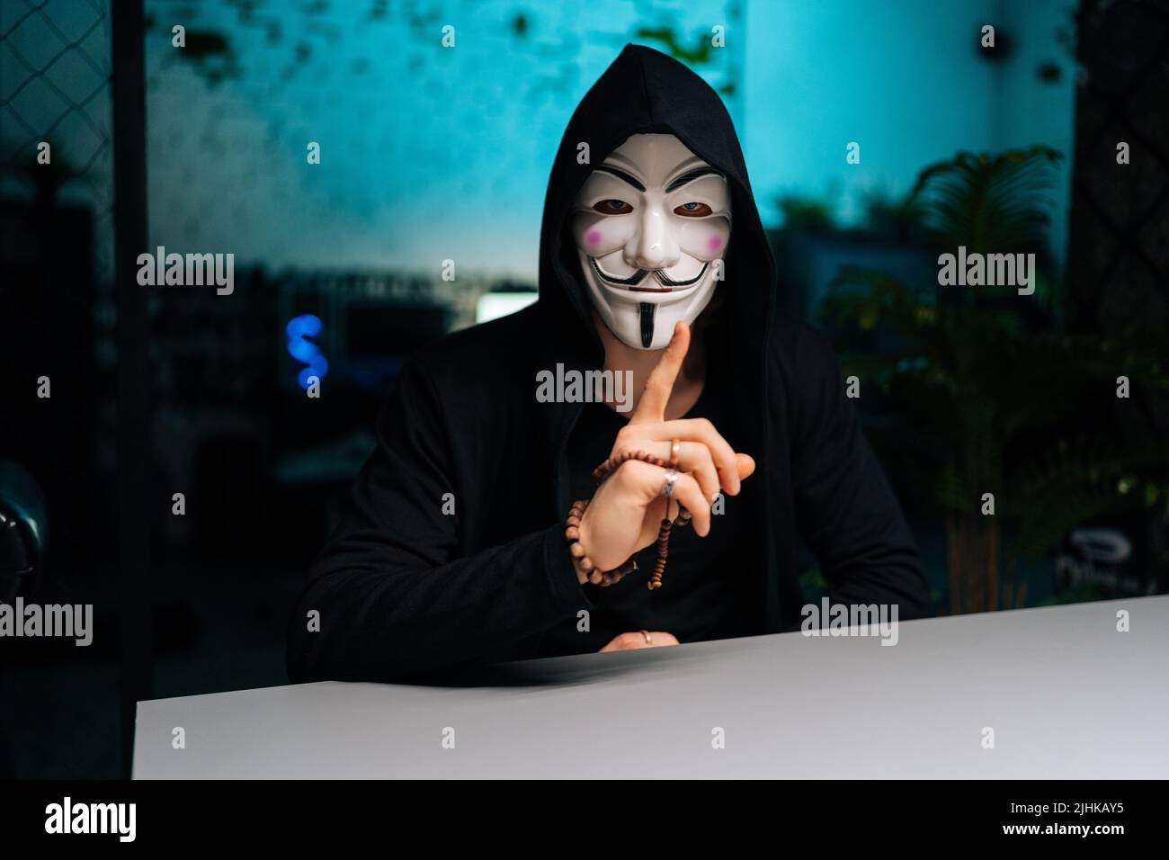 Man wearing anonymous mask hi-res stock photography and images - Alamy