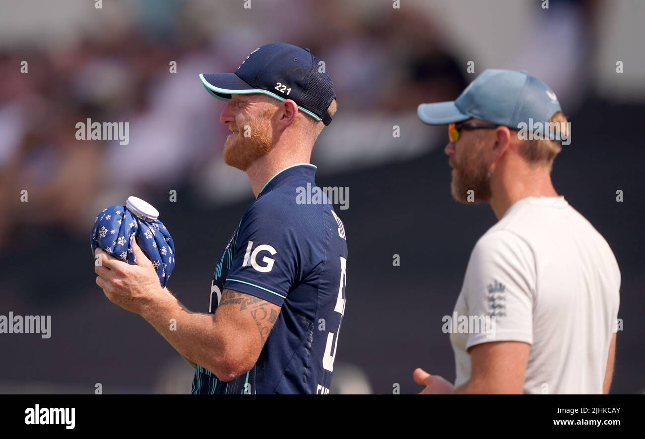 England's Ben Stokes uses an ice pack on his hand during the first one ...