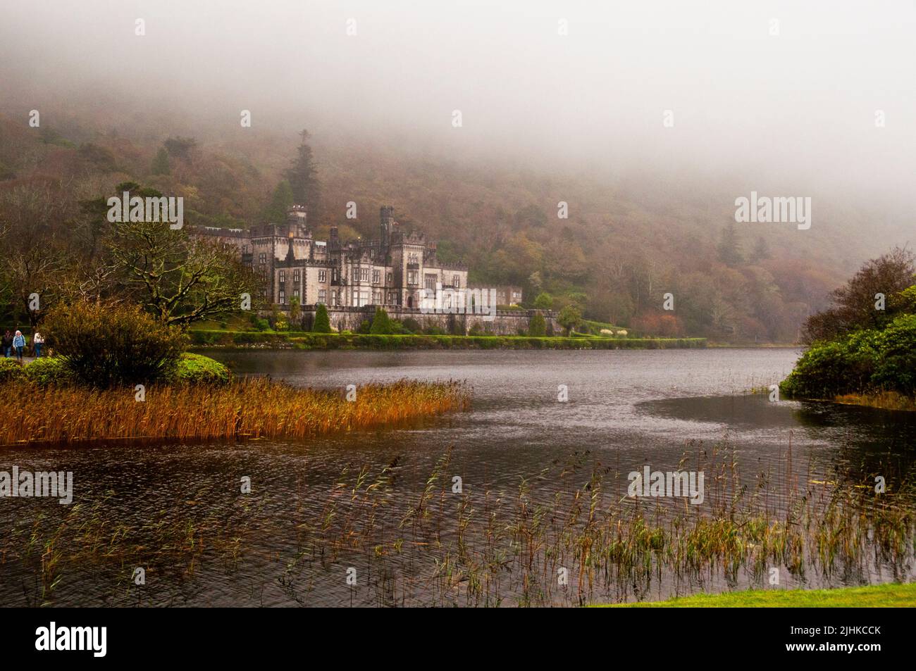 Irish Gothic castle Kylemore Abbey on the shores of Lough Pollacappul ...
