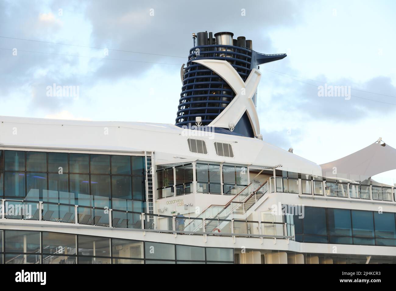 The large X on the smoke stack is the logo for Celebrity Cruise Lines Stock Photo - Alamy
