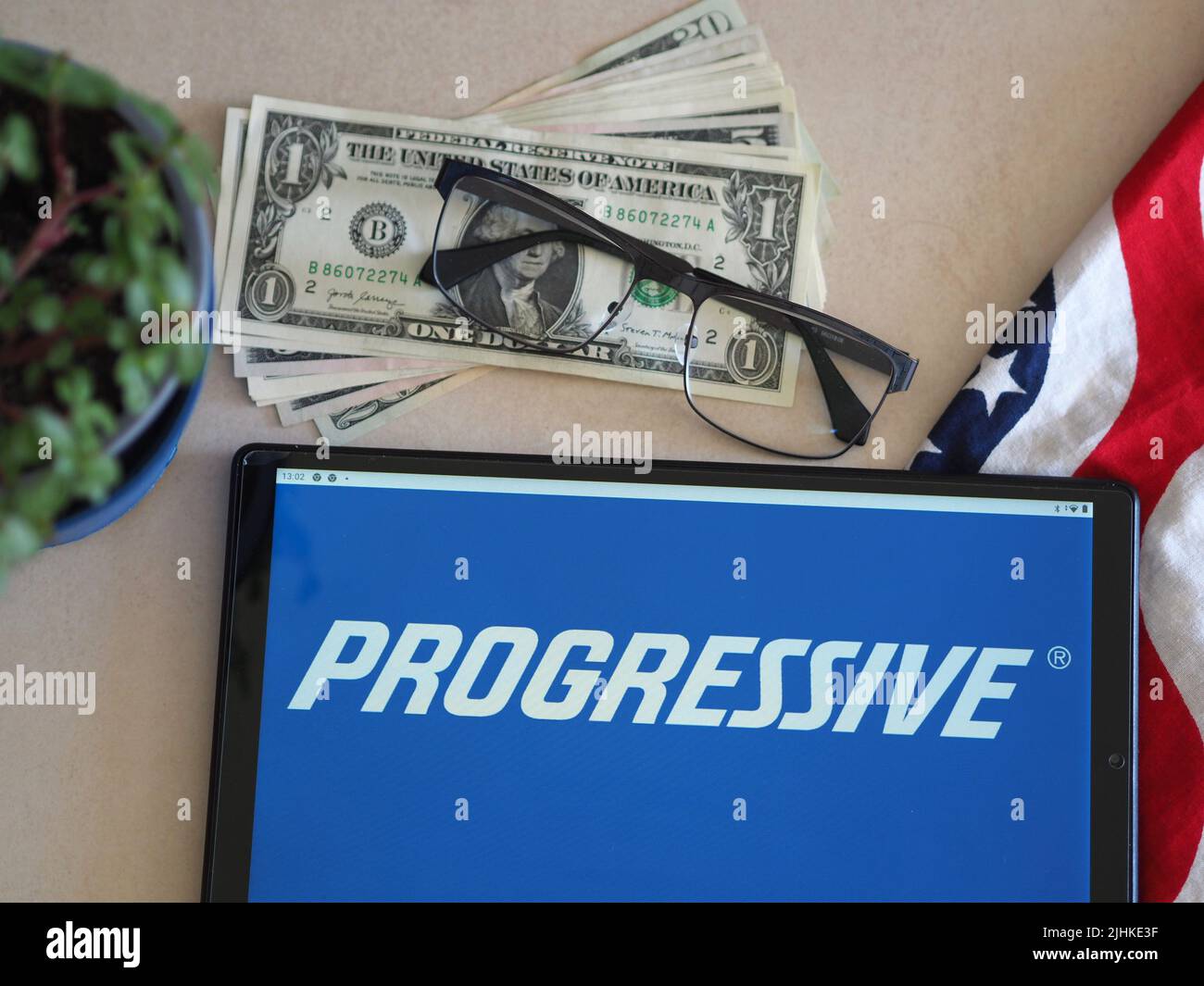 In this photo illustration, Progressive Corporation logo seen displayed ...