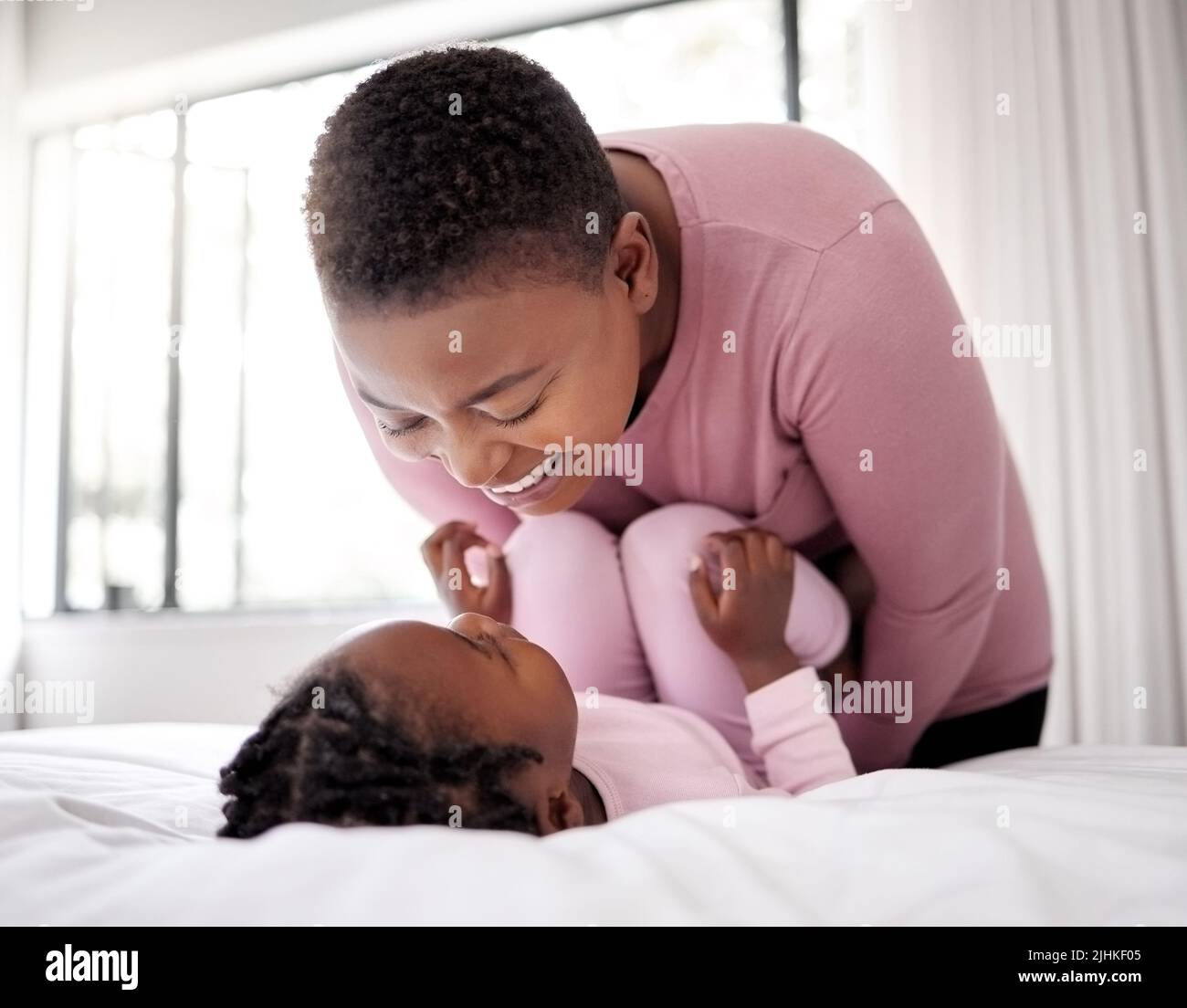 Mom, just five more minutes. a beautiful young woman bonding with her ...