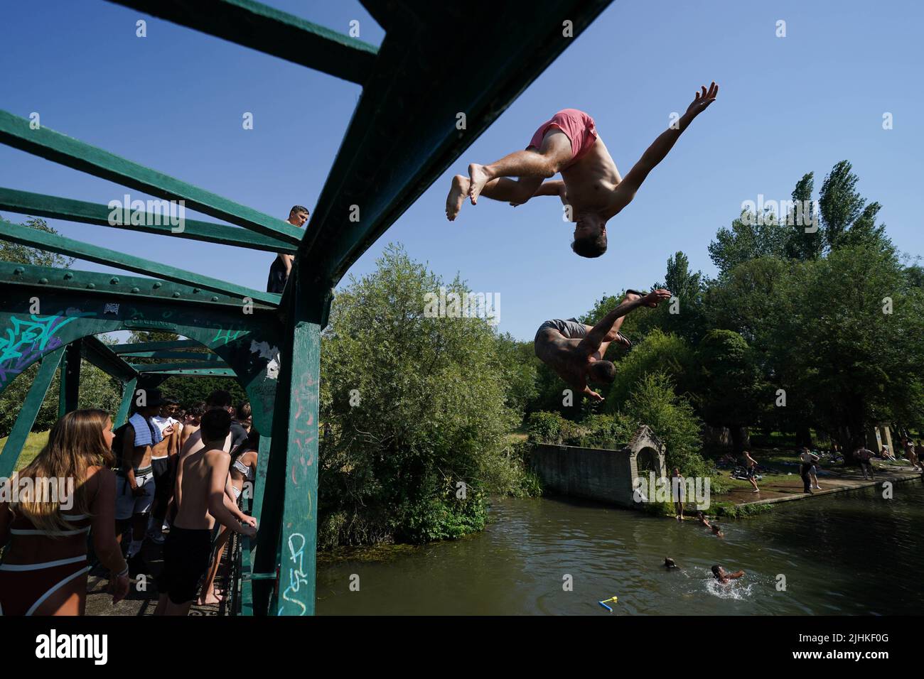 People jump into the Cam in Cambridge. Temperatures have reached 40C ...