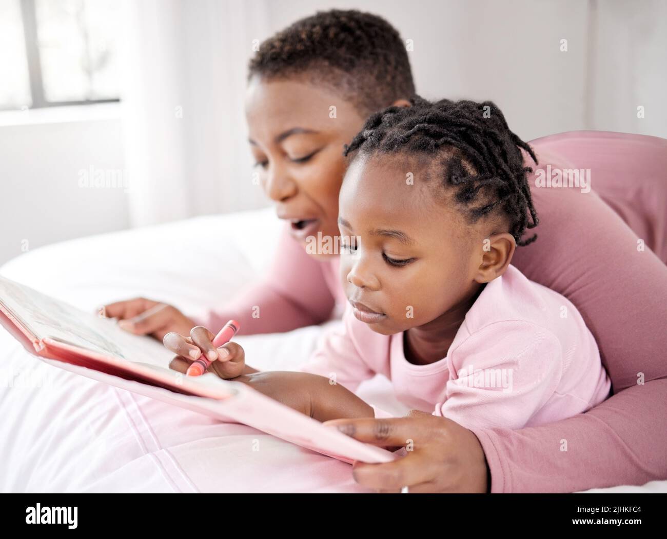 Say it slowly, baby girl. a beautiful young woman bonding with her ...