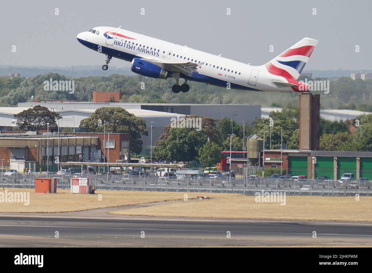 A British Airways flight takes off in the heat at Heathrow Airport ...
