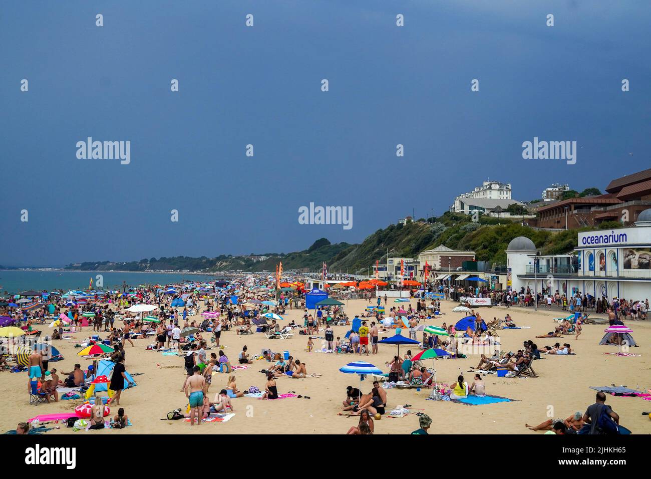 People on the beach in Bournemouth. Temperatures have reached 40C for ...