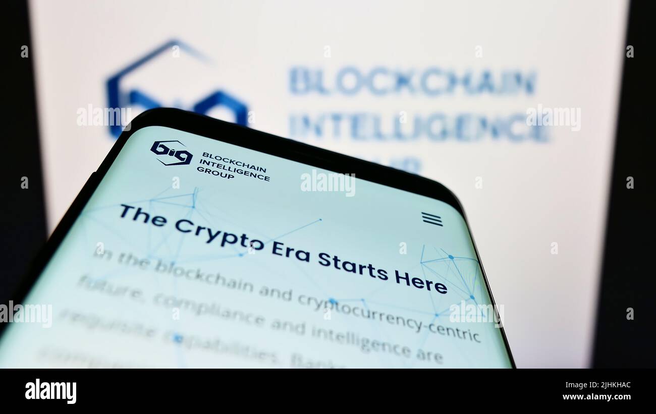 Mobile phone with website of company Blockchain Intelligence Group (BIG ...