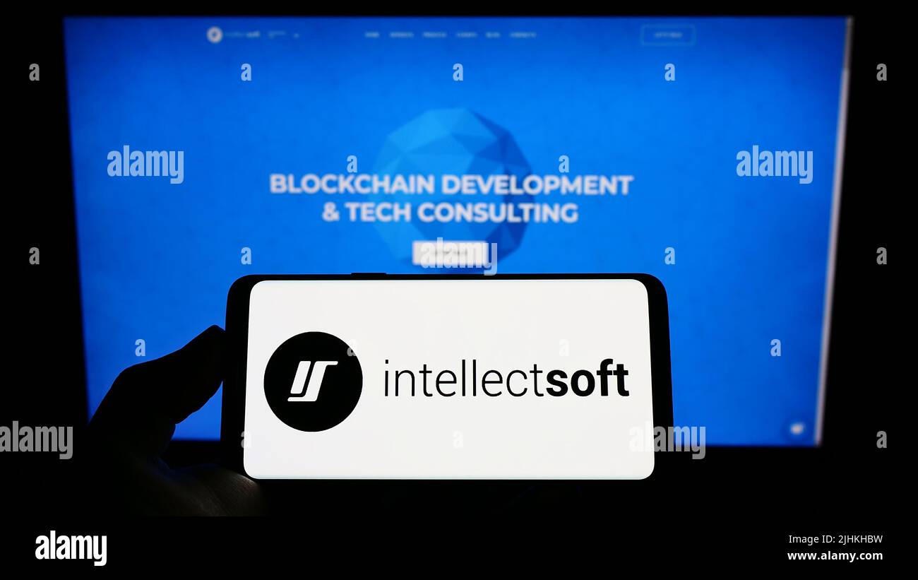 Person holding mobile phone with logo of American software company ...