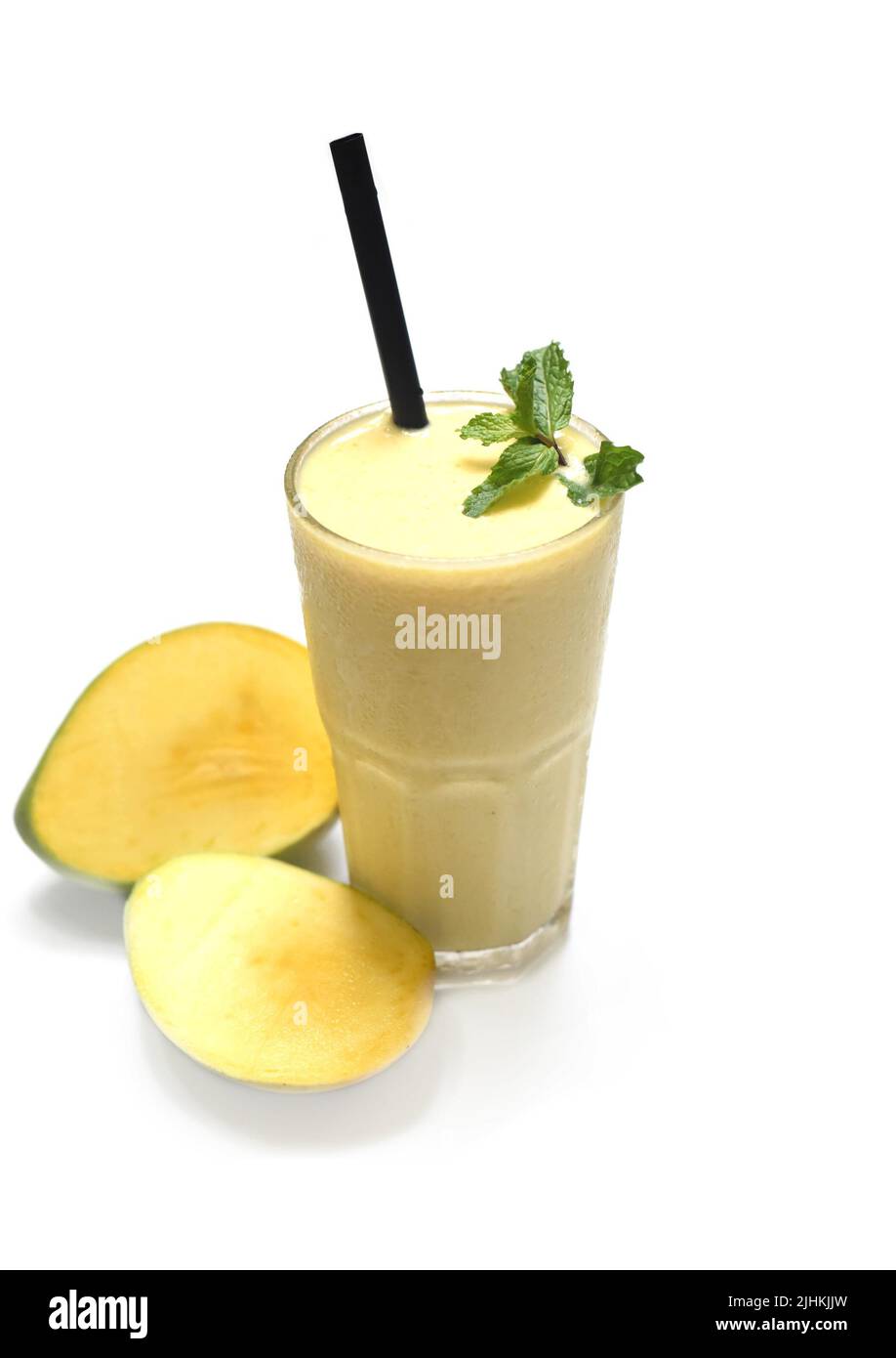 Mango lassi with sliced fresh mango isolated on white background Stock ...