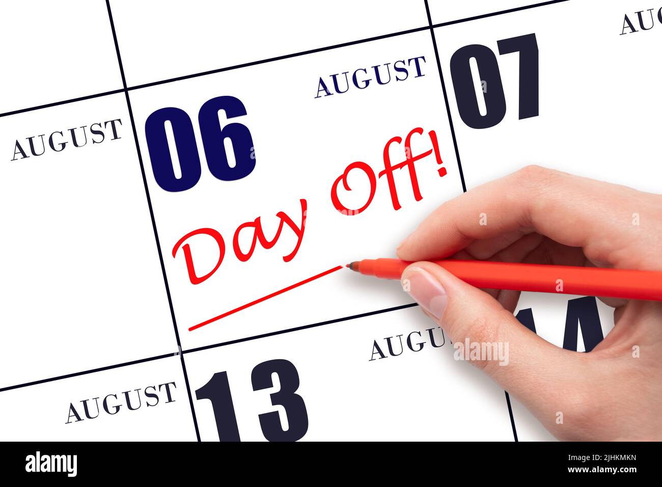 6th day of August. Hand writing text DAY OFF and drawing a line on ...