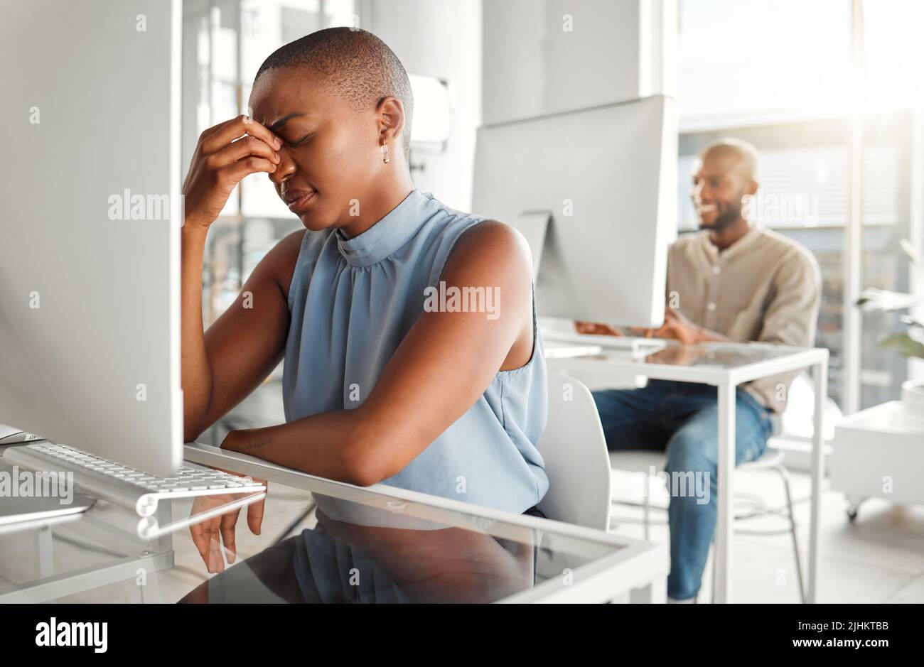 Young stressed african american businesswoman suffering from a headache ...