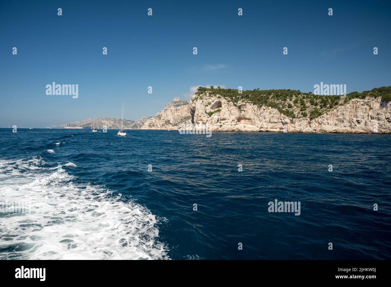 Limestone cliffs and blue sea near Cassis, boat excursion to Calanques ...