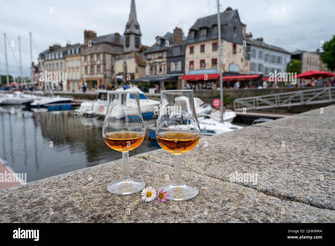 Tasting of apple calvados drink from glasses in old Honfleur harbour ...