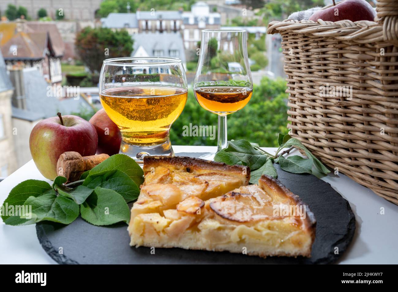 Apple products of Normandy region, homemade baked apple cake, glasses ...