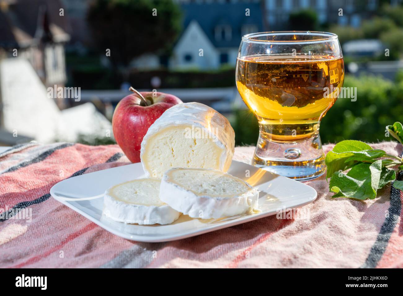 Products of Normandy, cow neufchatel lait cru cheese and glass of apple ...