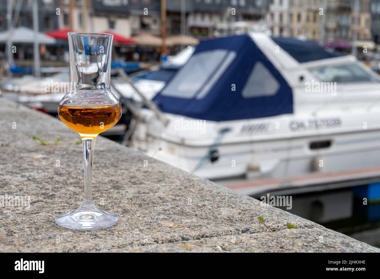 Tasting of apple calvados drink from glasses in old Honfleur harbour ...