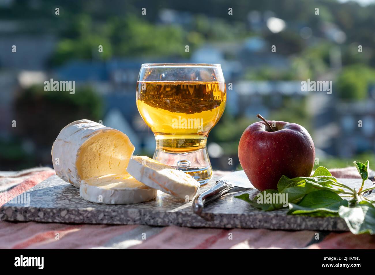 Products of Normandy, cow neufchatel lait cru cheese and glass of apple ...