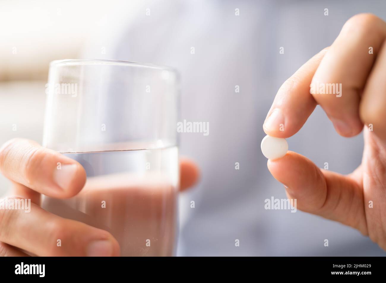 Sick Man Taking Medicine Drug. Antibiotic In Hand Stock Photo - Alamy