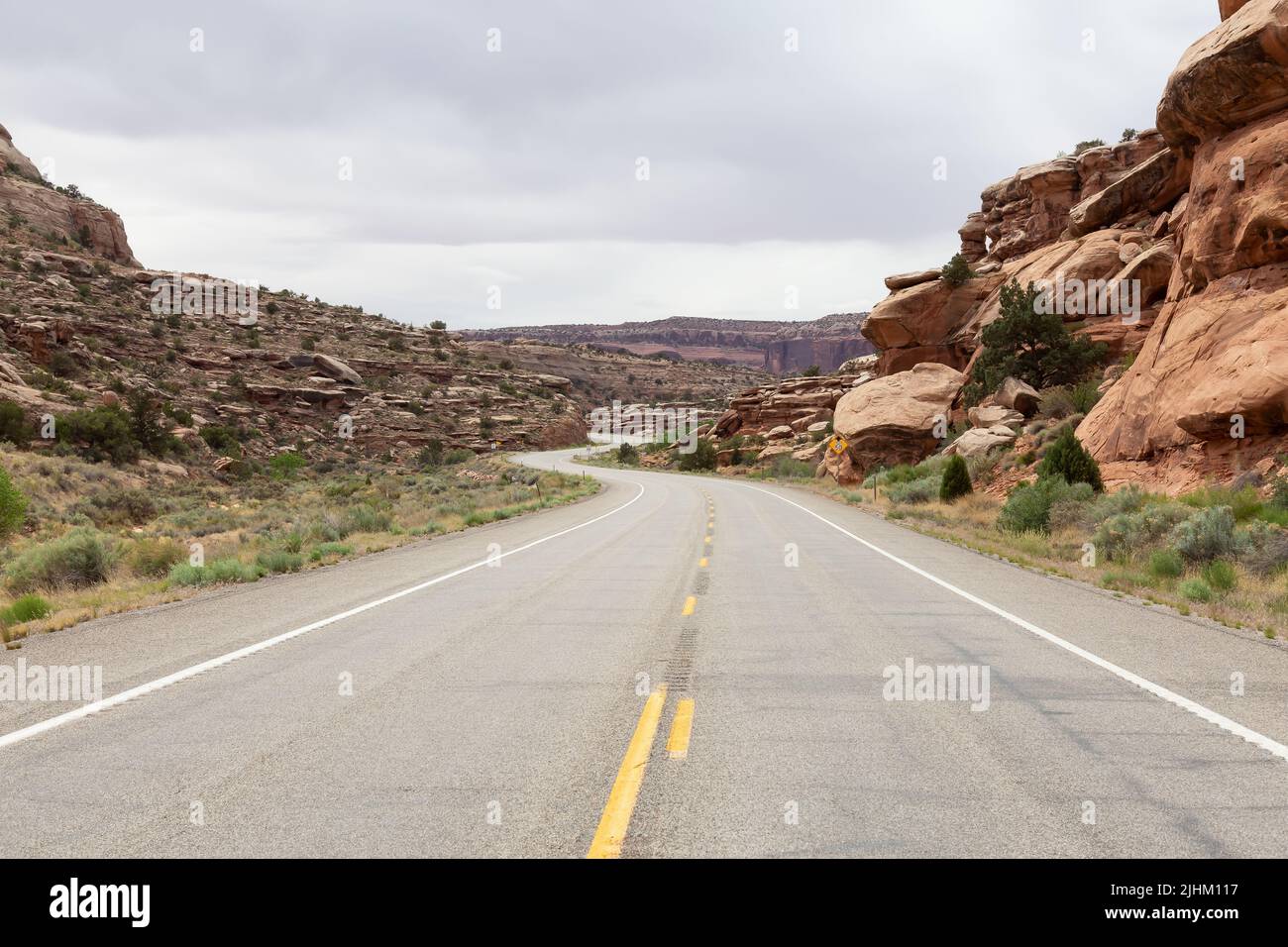 Scenic Road surrounded by Red Rock Mountains in the Desert Stock Photo ...