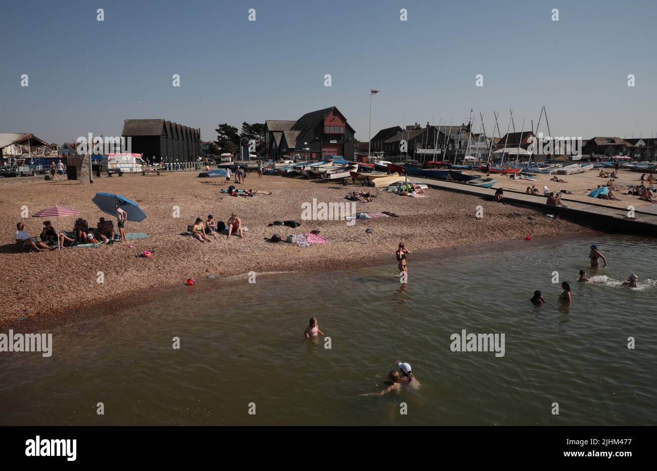 Whitstable, UK. 19th July, 2022. Members of the public enjoy the beach ...