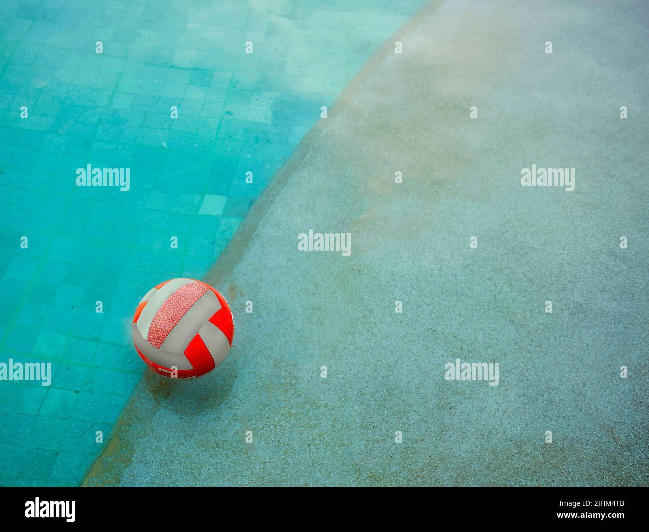 A Water volleyball floating on water in the swimming pool in a rainy ...