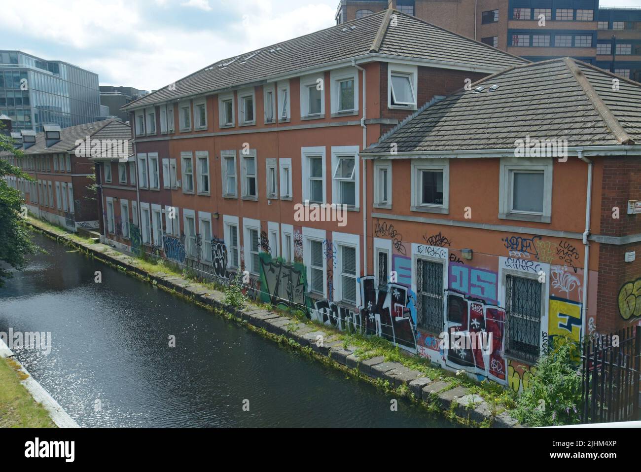 Tagging and graffiti covered buildings by the Grand Canal, Dublin ...