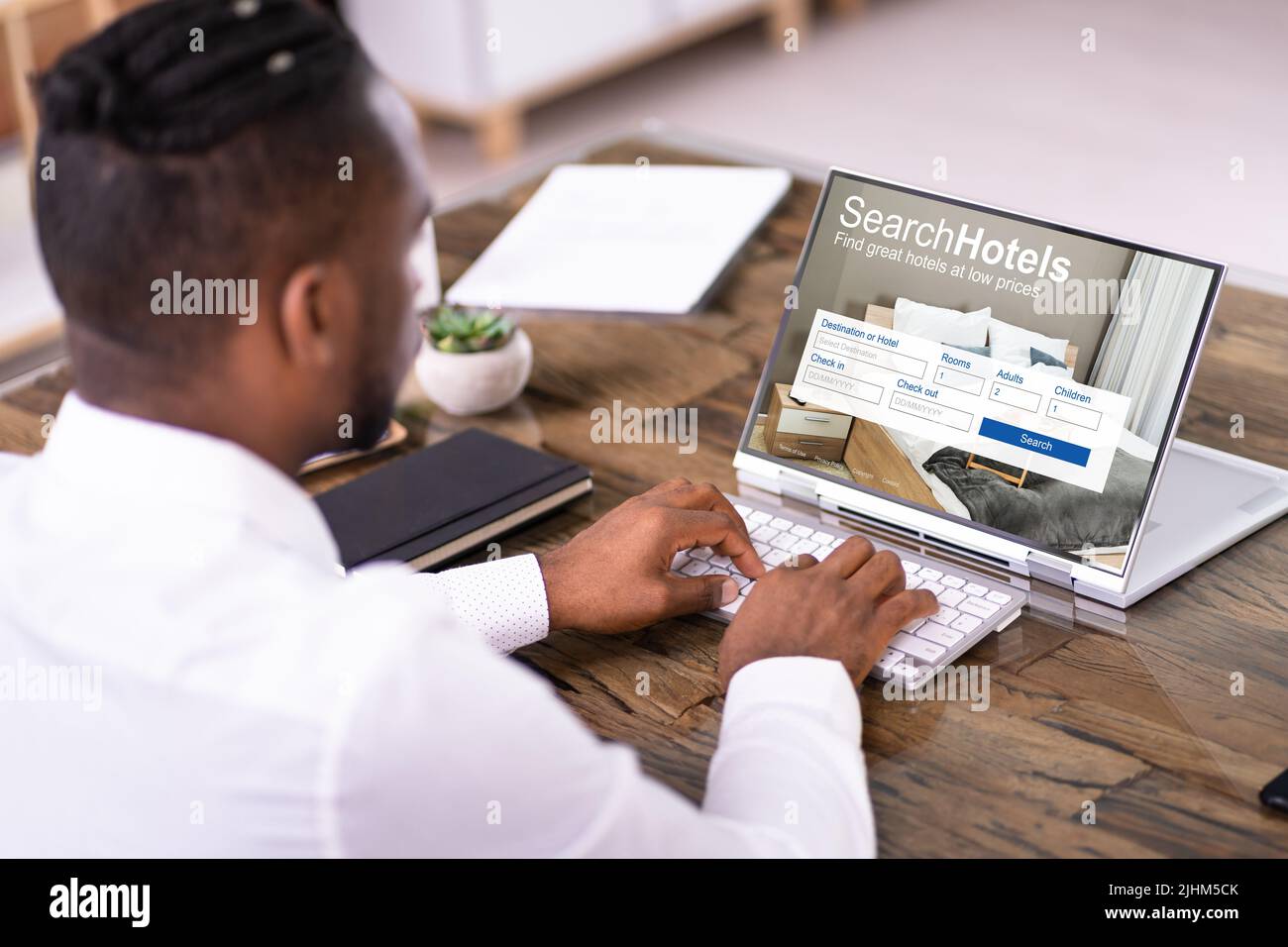 Online Hotel Booking Using Hybrid Laptop. Website On Screen Stock Photo ...