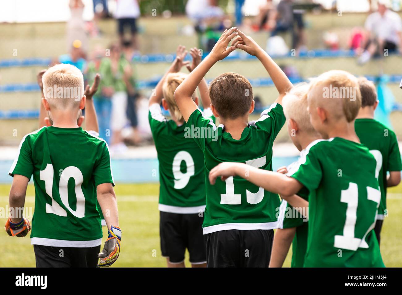 A boys soccer team celebrating a victory. Motivated children sports ...