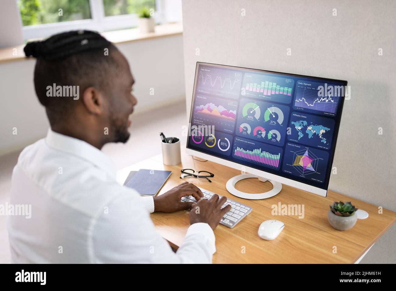 Analyst Man Looking At Business Data Analytics Dashboard Stock Photo ...