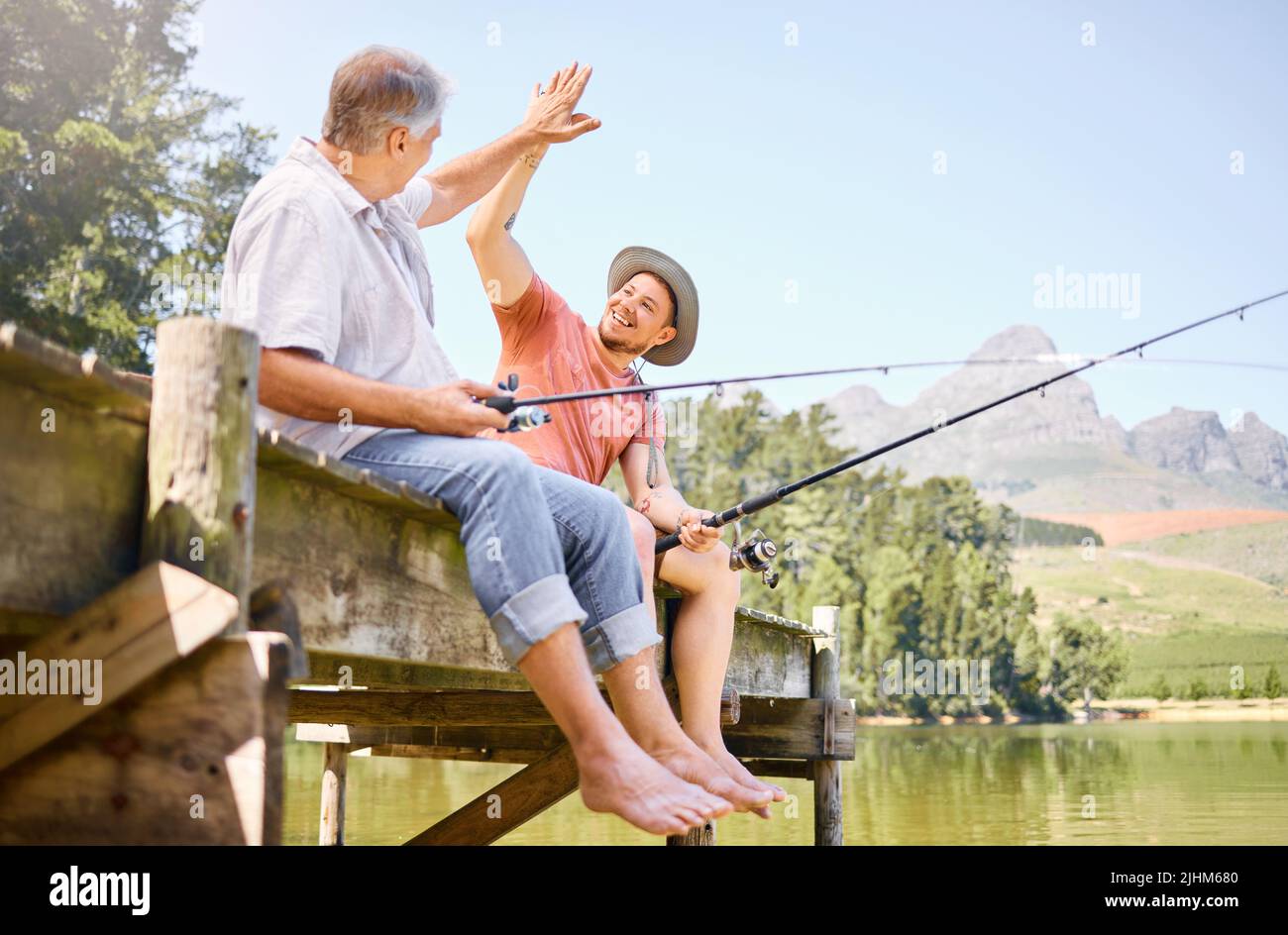 Heres to catching them all. a man giving his father a high five while ...