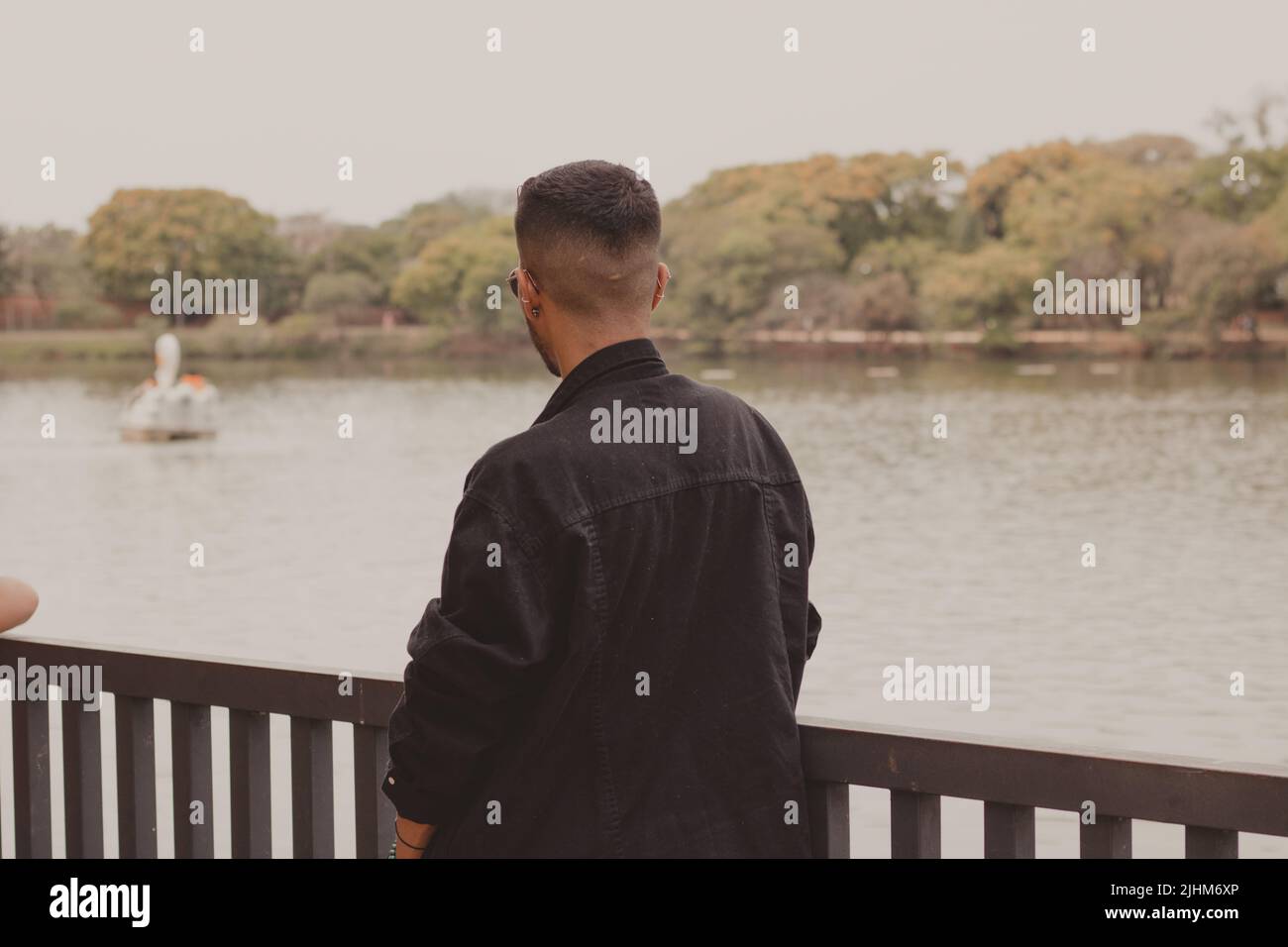 back view of a young man looking at the lagoon view Stock Photo - Alamy