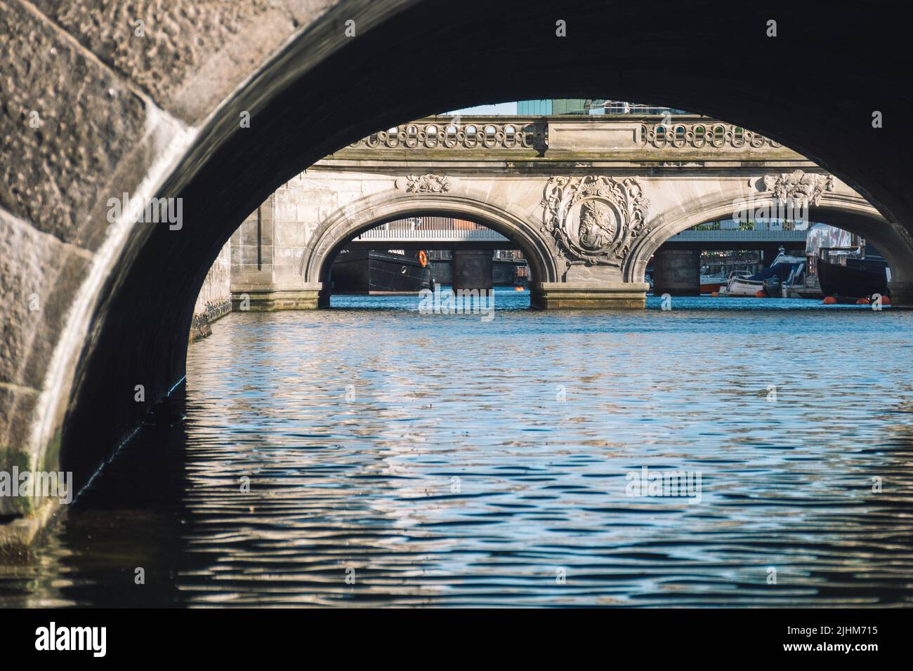 Beautiful view from the cruise boat of the old bridges on the canals of ...