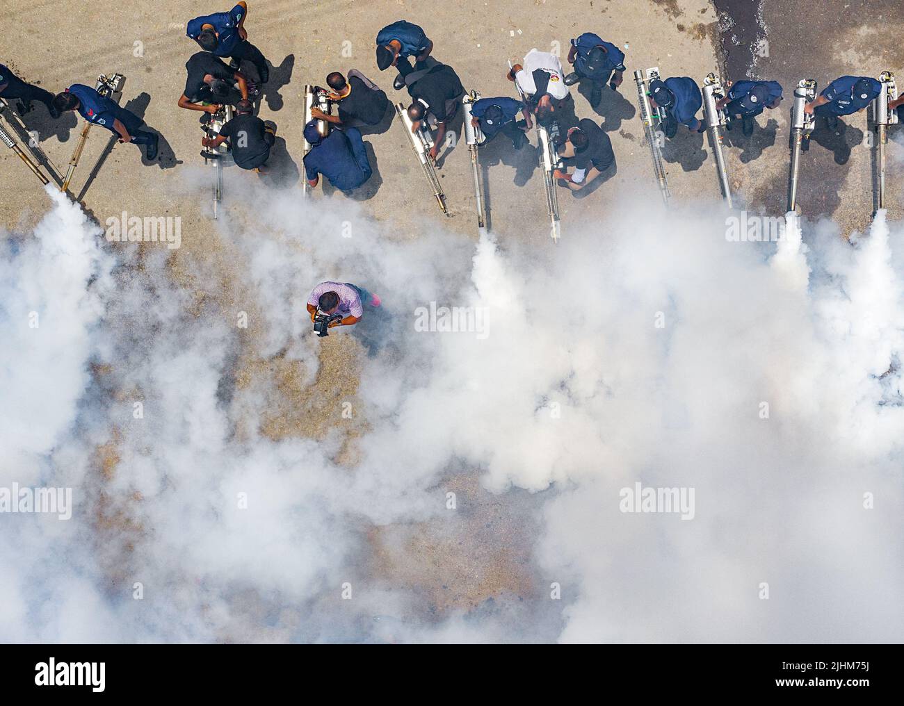 Police spraying smoke and pesticide on streets to fight dengue ...