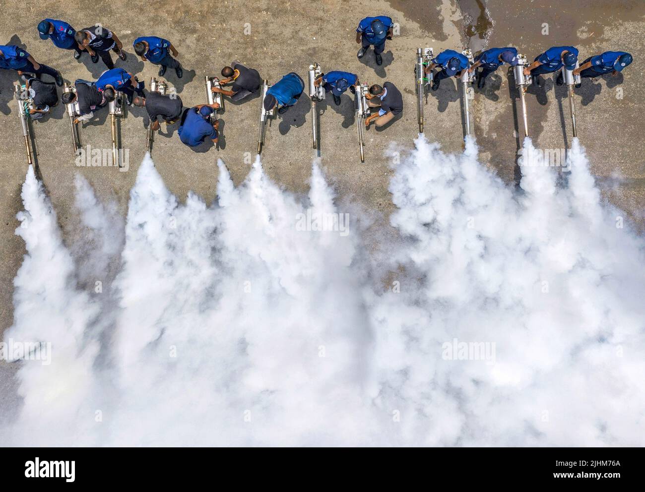 Police spraying smoke and pesticide on streets to fight dengue ...