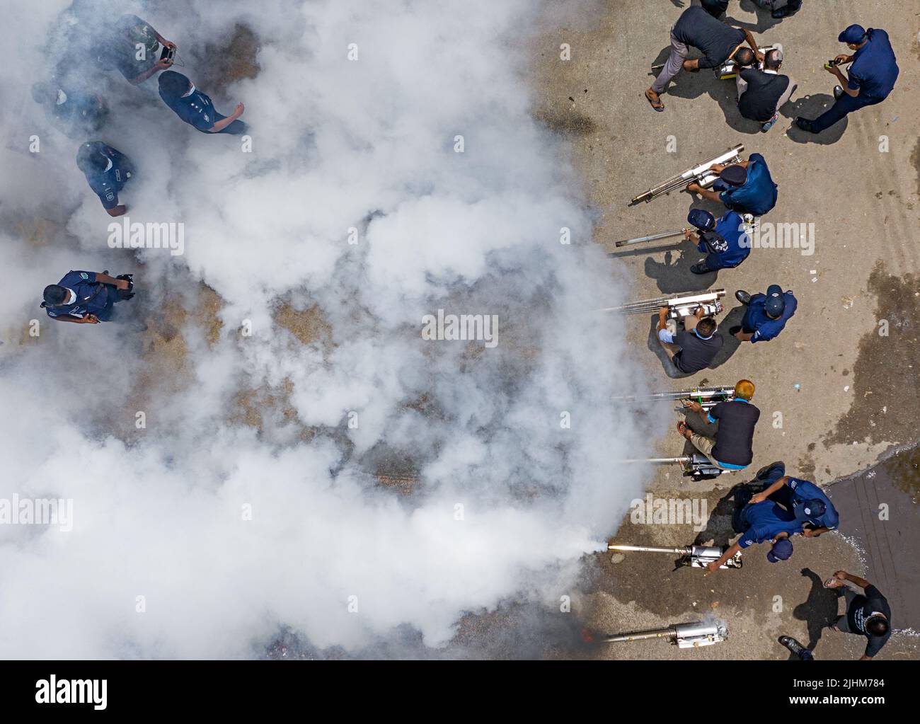 Police spraying smoke and pesticide on streets to fight dengue ...