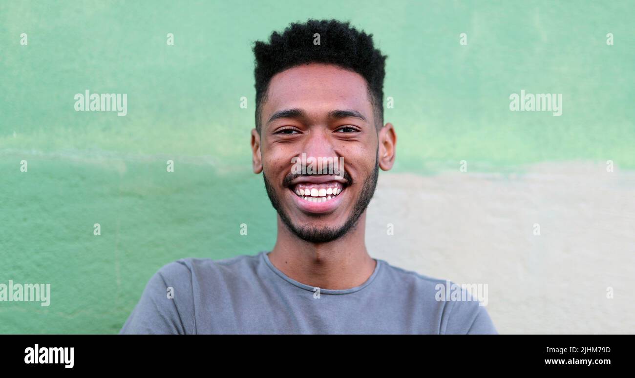 Happy young black man laughing and smiling. African ethnicity real life ...